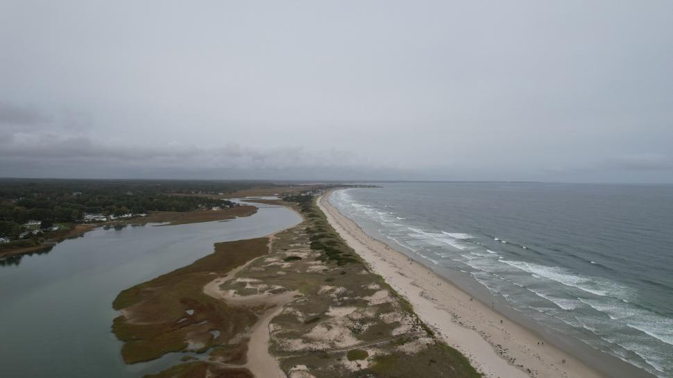 Free Stock Photo of Aerial view of a long sandy beach meets the ocean ...