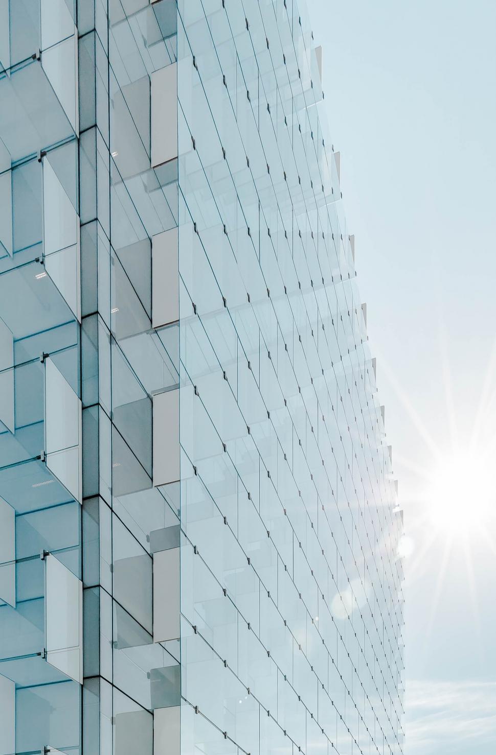 Free Stock Photo of Modern glass building with sunlight reflecting off ...