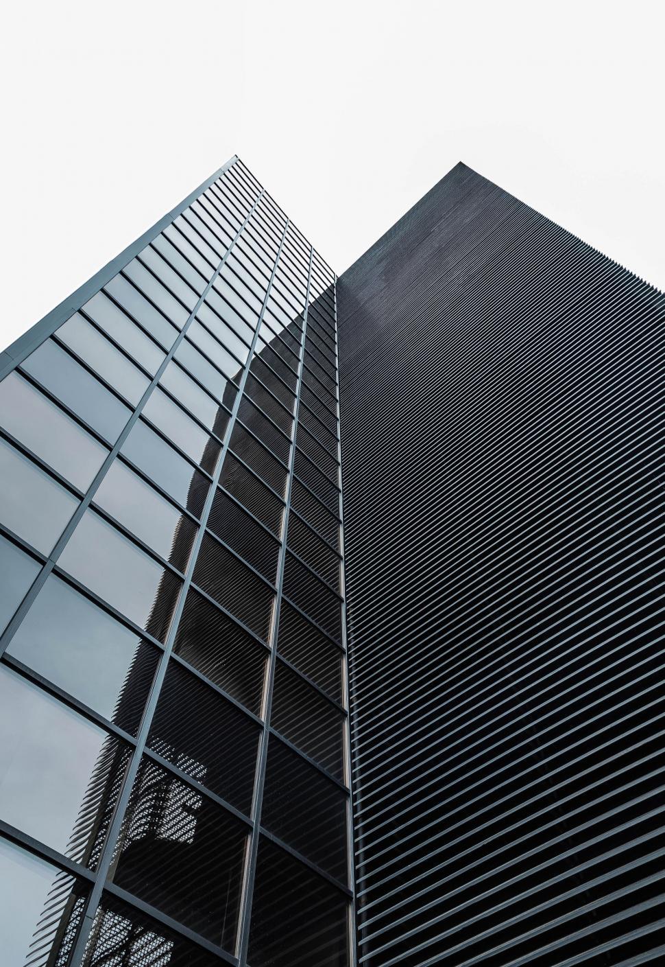 Free Stock Photo of Tall modern skyscraper with sleek black glass ...