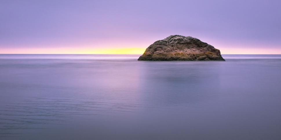 Free Stock Photo of Solitary rock against the calm ocean at sunset ...