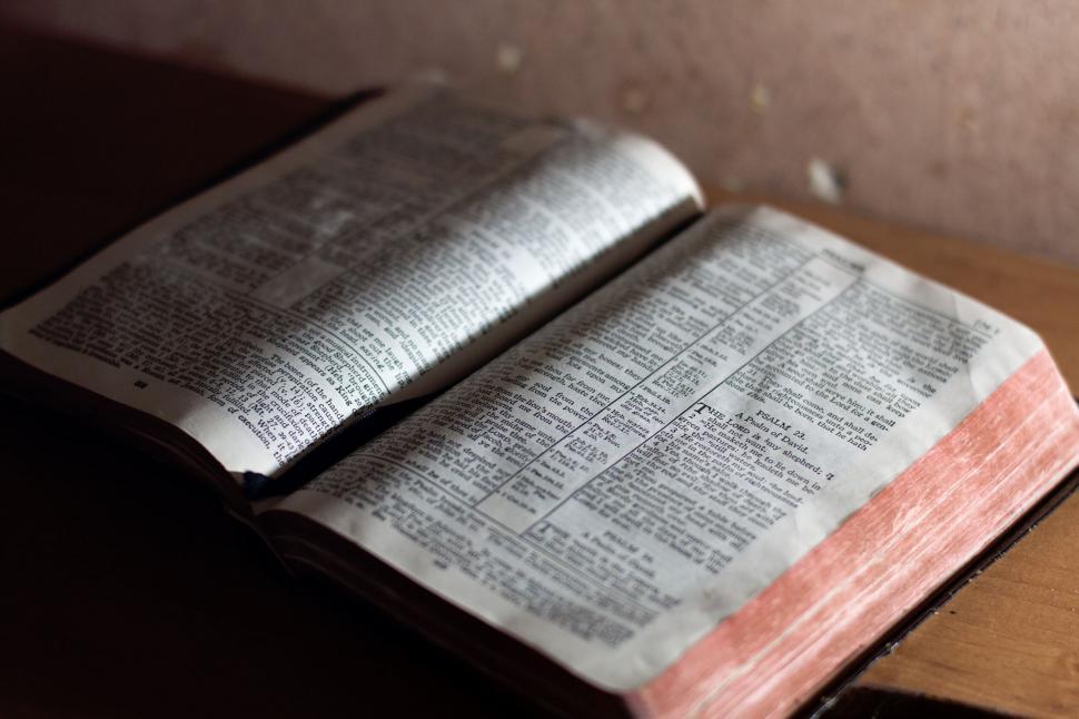 Free Stock Photo of Open book with text lit from a side angle indoors ...