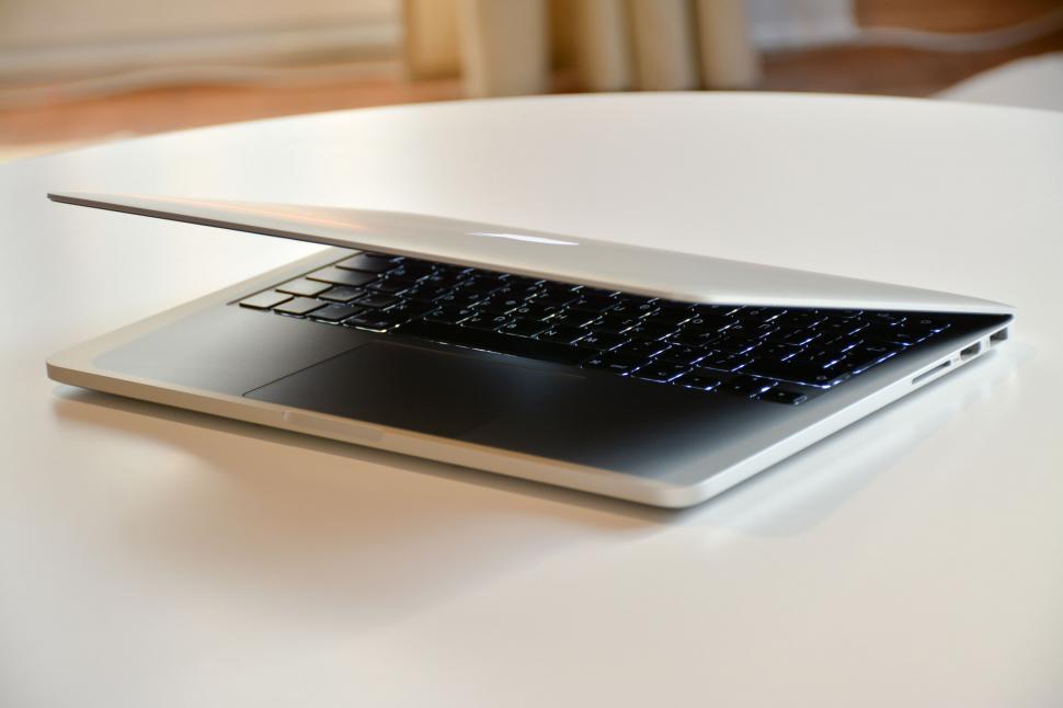 Free Stock Photo of Partially open MacBook Pro highlighting illuminated ...