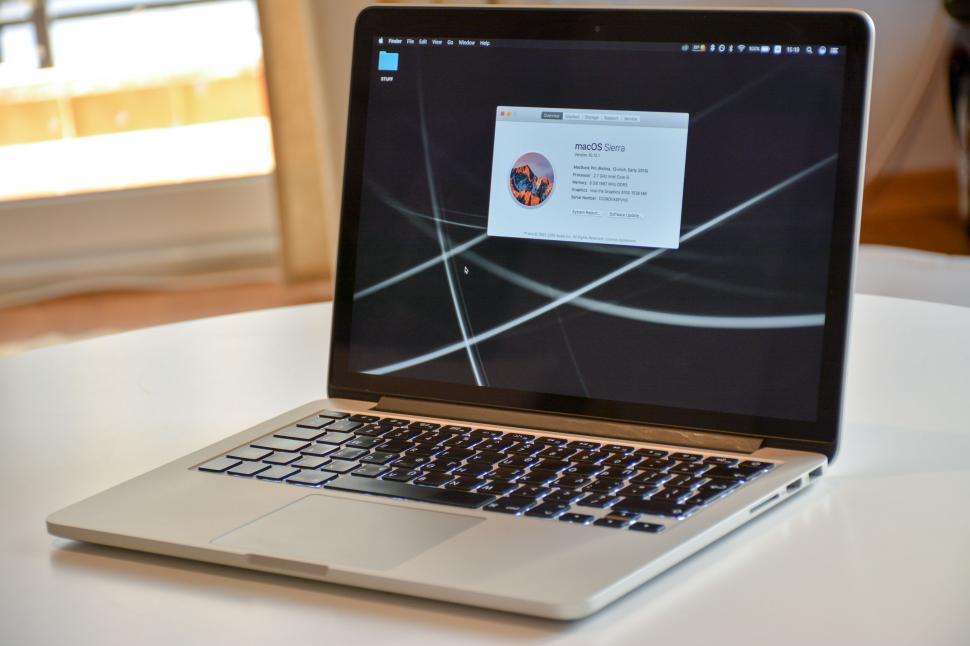 Free Stock Photo of Open laptop on a white table with macOS Sierra open ...