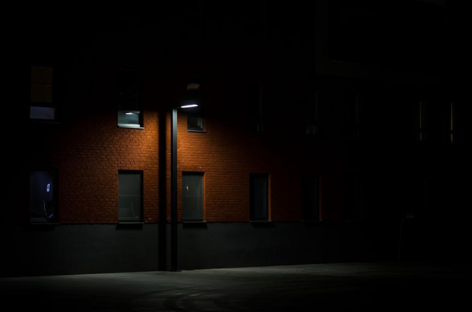 Free Stock Photo of Dimly lit urban building exterior at night ...