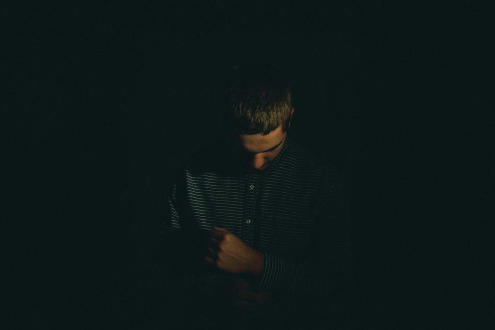 Free Stock Photo of Man in dim light with striped shirt looking ...