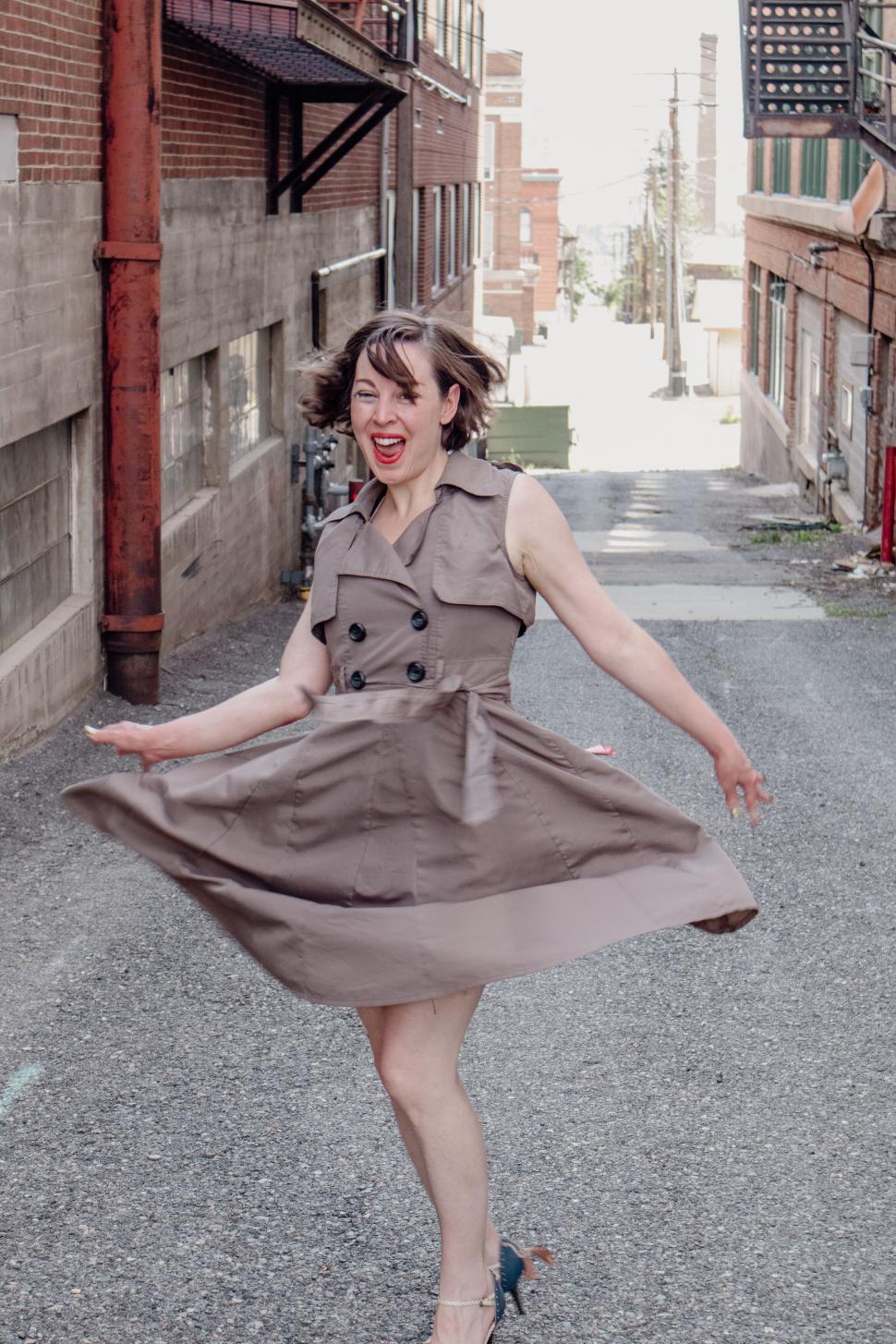 Free Stock Photo of Woman twirling in beige dress in urban alleyway ...