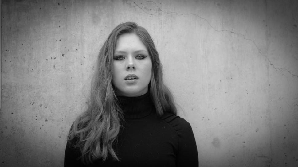 Free Stock Photo of Woman with solemn expression against concrete wall ...