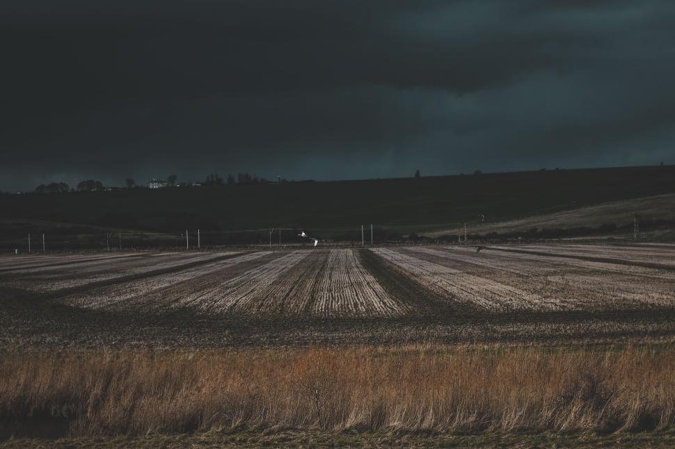 Free Stock Photo of Dark cloudy sky over a large agricultural field in ...
