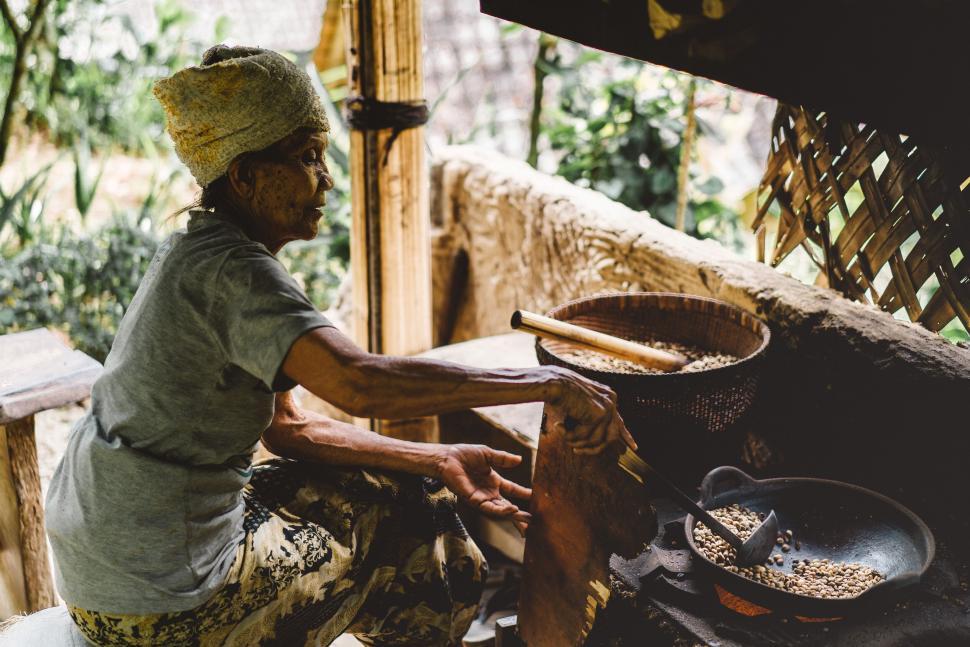 Free Stock Photo of Woman preparing food using traditional methods in ...