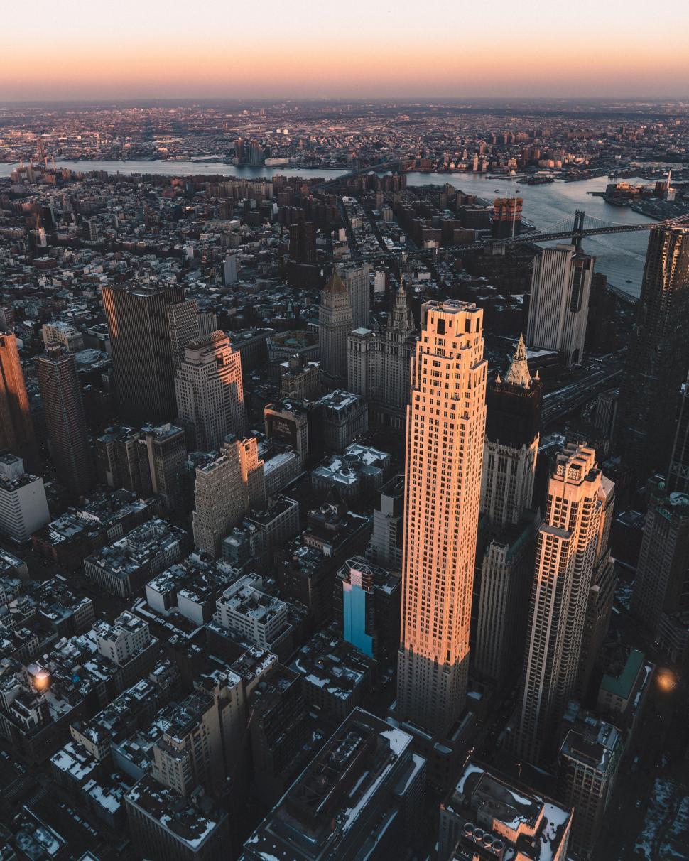 Free Stock Photo of Aerial view of city skyscrapers illuminated by the ...