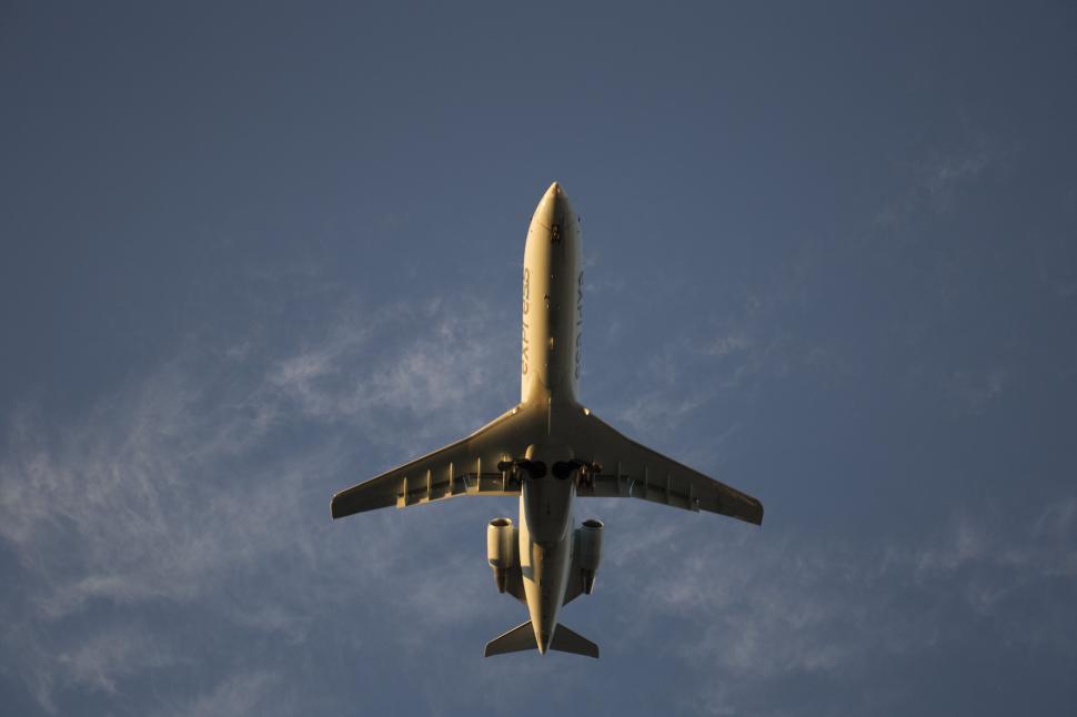 Free Stock Photo of Airplane viewed from below flying against clear ...