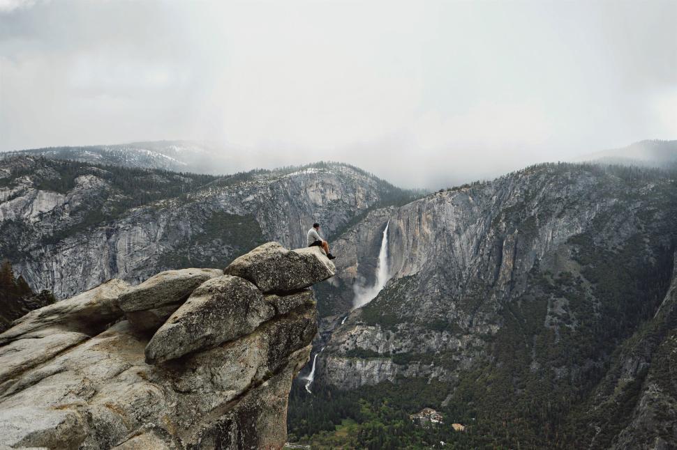 Free Stock Photo of Solitary figure on rock ledge overlooking ...