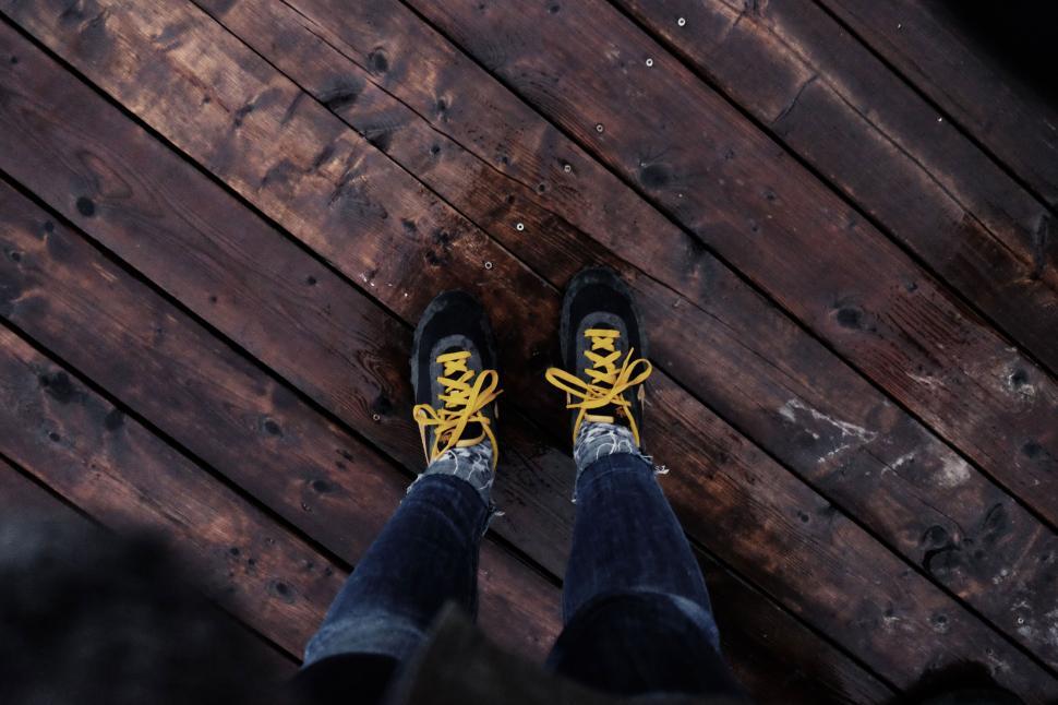 Free Stock Photo of Person standing on a wooden patio deck with yellow ...