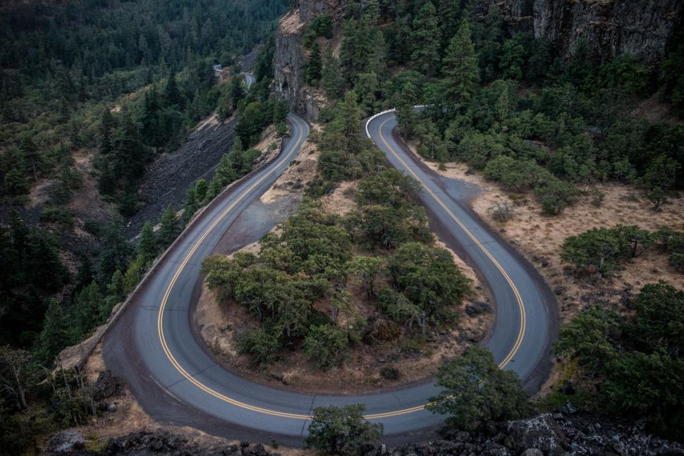 Free Stock Photo of Winding mountain road with sharp bends surrounded ...