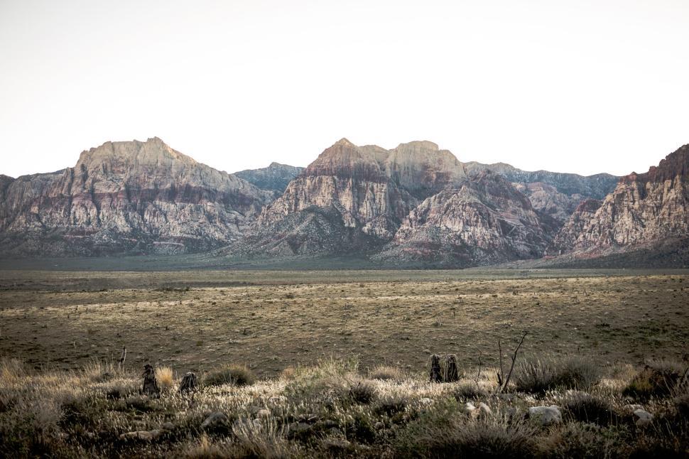Free Stock Photo of Vast open desert plain leading to rugged mountain ...