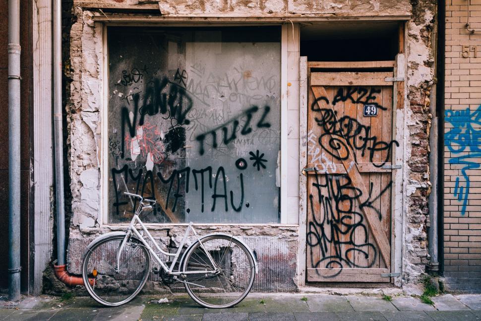 Free Stock Photo of Graffiti-covered storefront with a white bicycle ...
