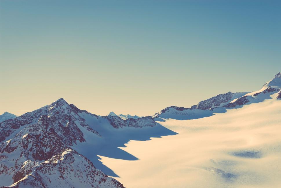 Free Stock Photo of Snow-covered mountains under clear blue sky with ...