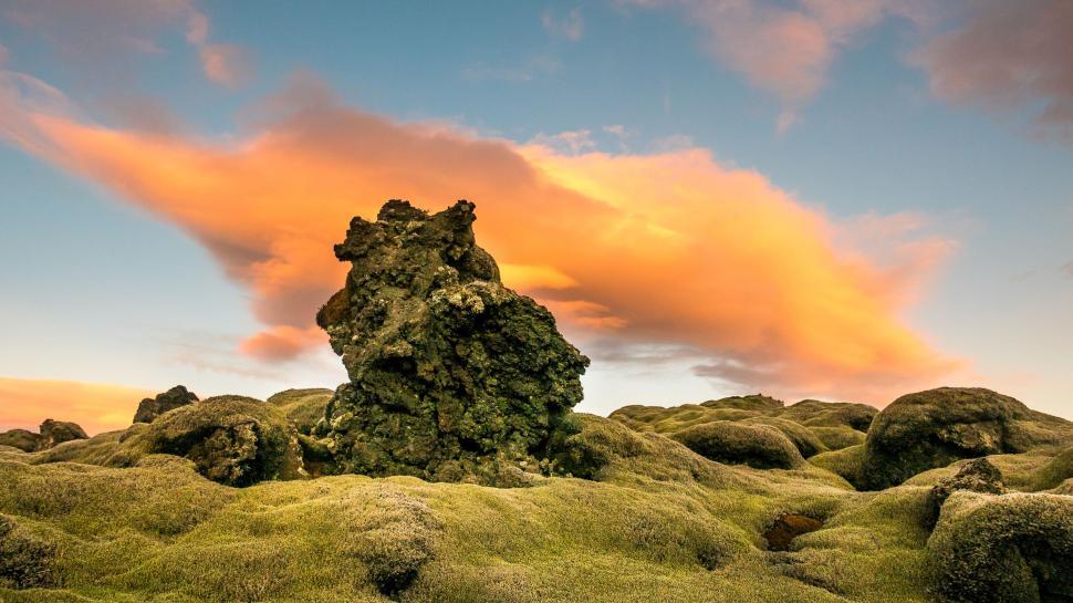 Free Stock Photo of Moss-covered rocks under colorful cloudy sky in ...
