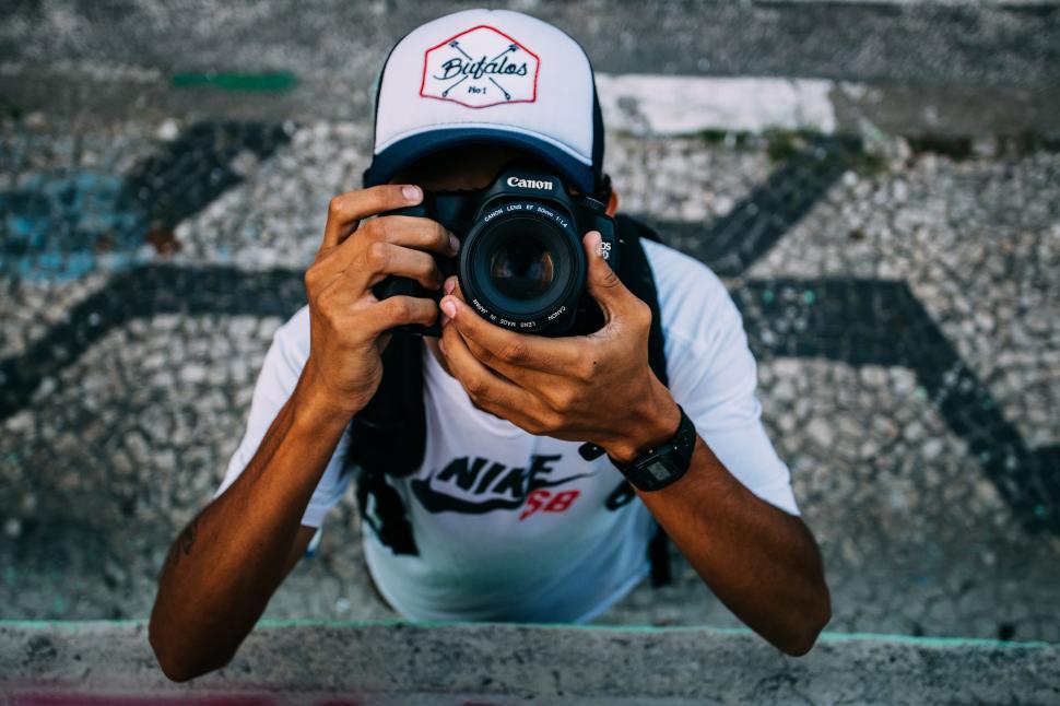 Free Stock Photo of Person with camera capturing a shot, wearing a ...