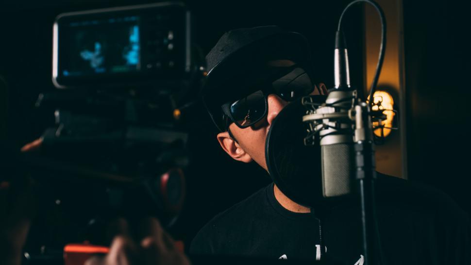 Free Stock Photo of Recording artist in a dark studio singing into a ...