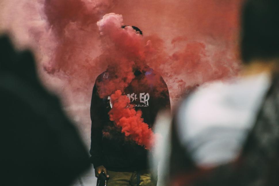 Free Stock Photo of Person holding red smoke flare with dramatic ...