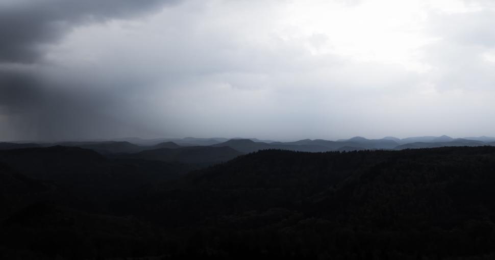 Free Stock Photo of Dark stormy sky over a vast hilly landscape with ...