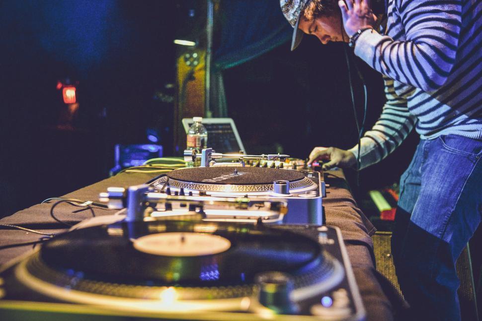 Free Stock Photo of DJ performing live with turntables and equipment on ...