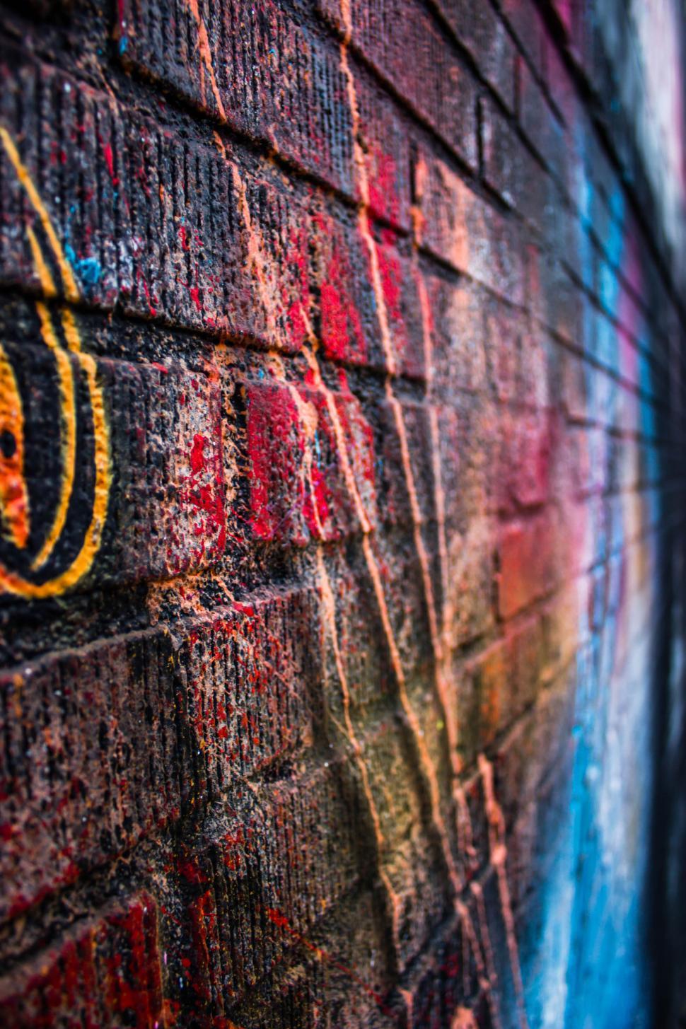 Free Stock Photo of Close-up of a colorfully painted brick wall with ...
