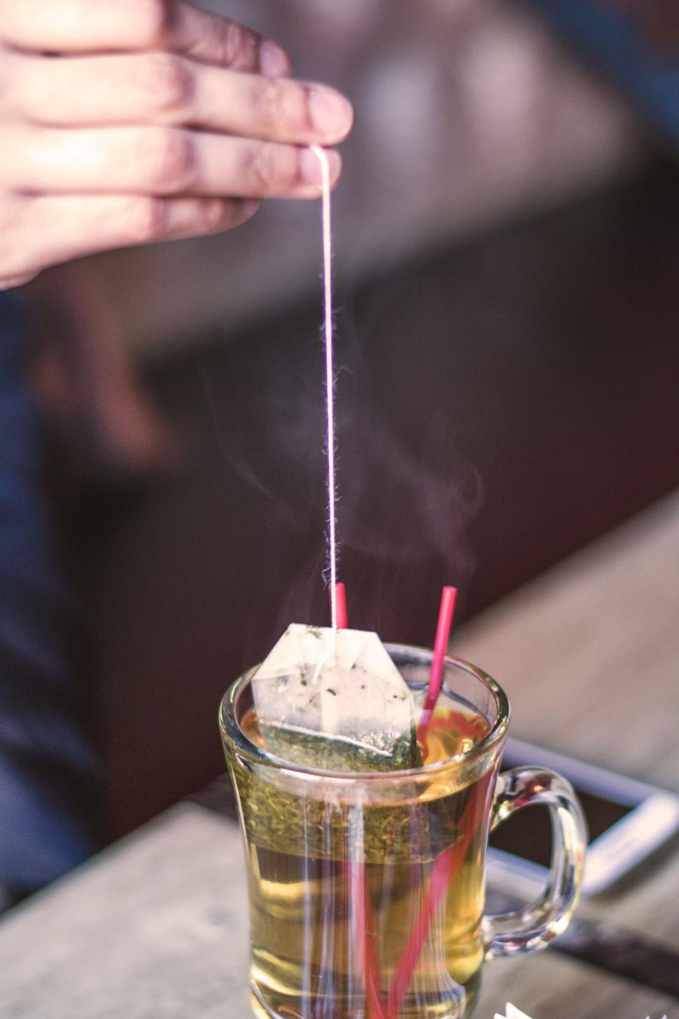 Free Stock Photo of Person brewing tea by dipping tea bag in a glass ...