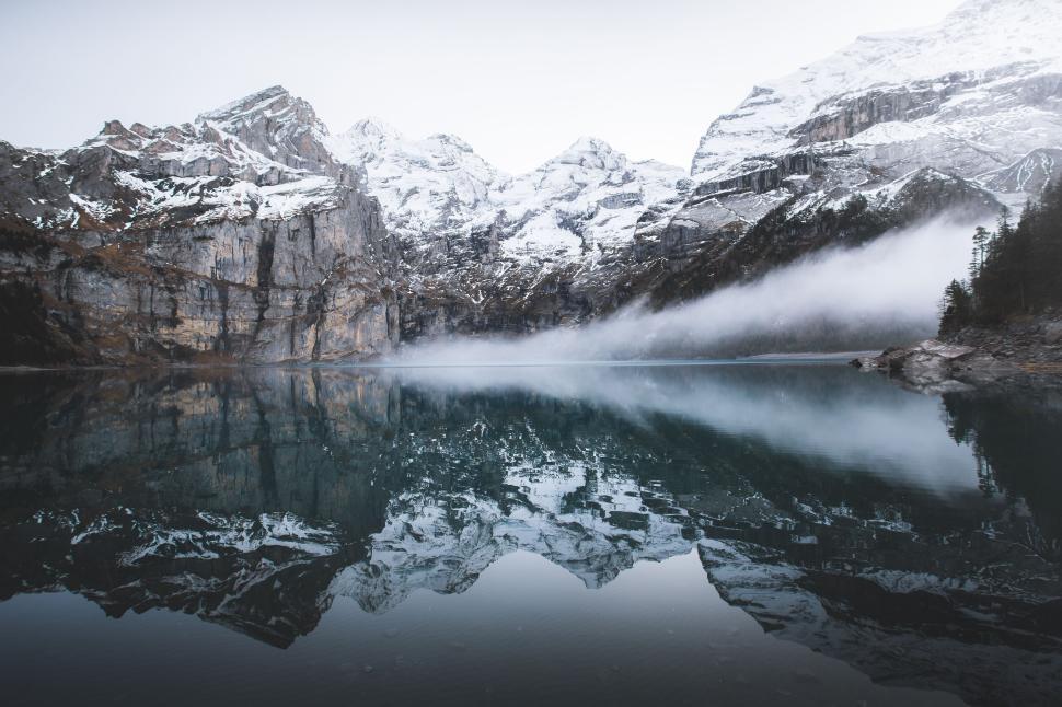 Free Stock Photo of Snowy mountains and mist reflecting in calm lake ...