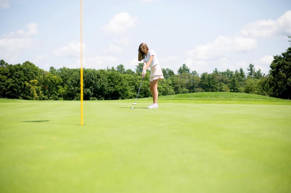 Free Stock Photo of Golfer concentrating on putting at an outdoor golf ...