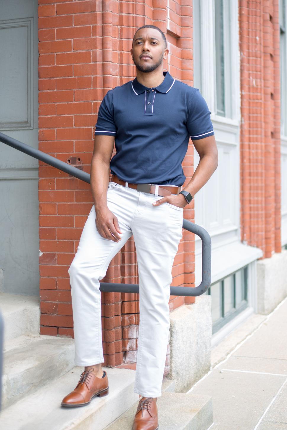 Free Stock Photo of Stylish man standing on steps in urban setting in ...