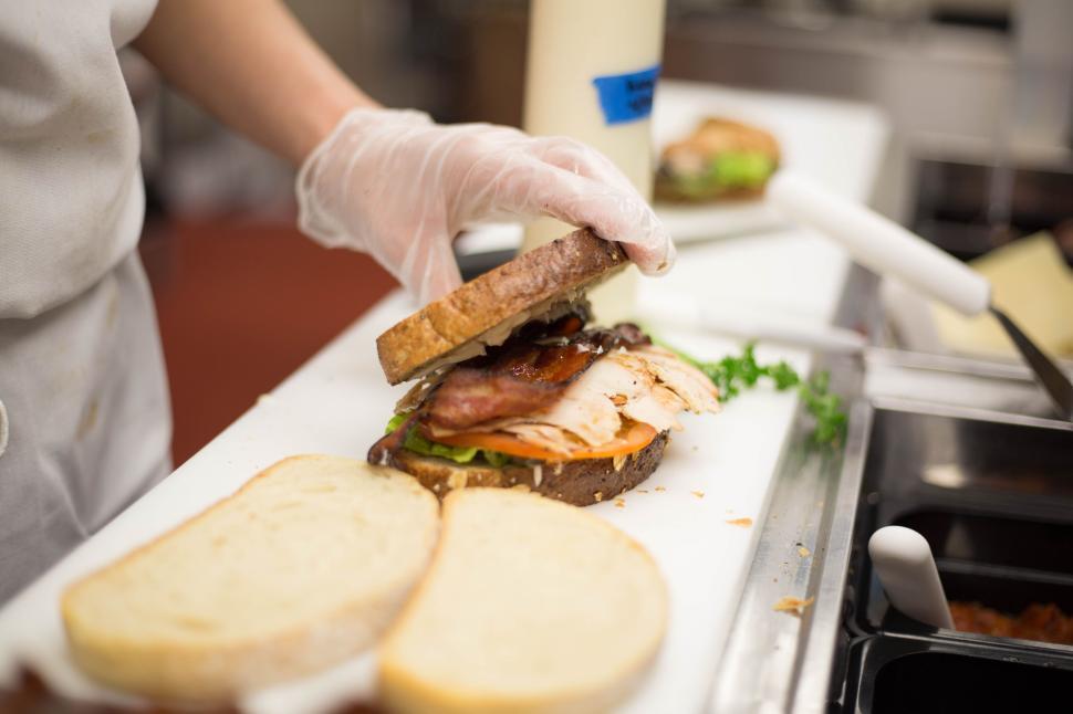 Free Stock Photo of Chef preparing a sandwich with gloves, placing ...