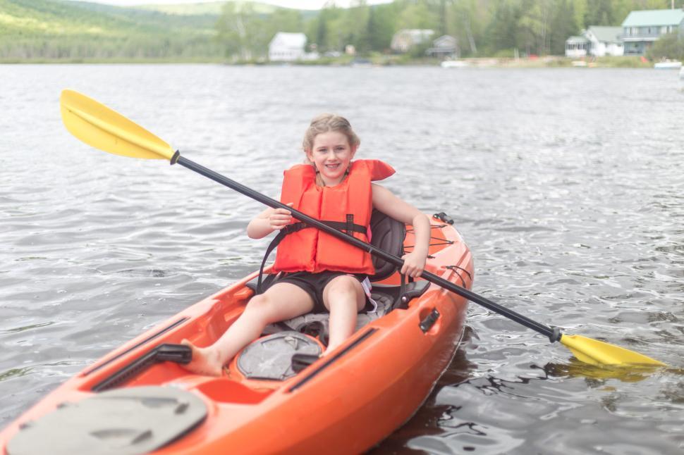 Free Stock Photo of Young girl kayaking on a lake with an orange kayak ...