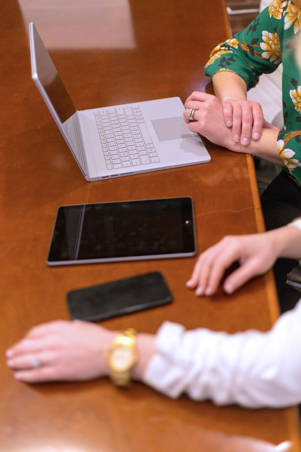 Free Stock Photo of Two people working on a laptop, tablet, and ...