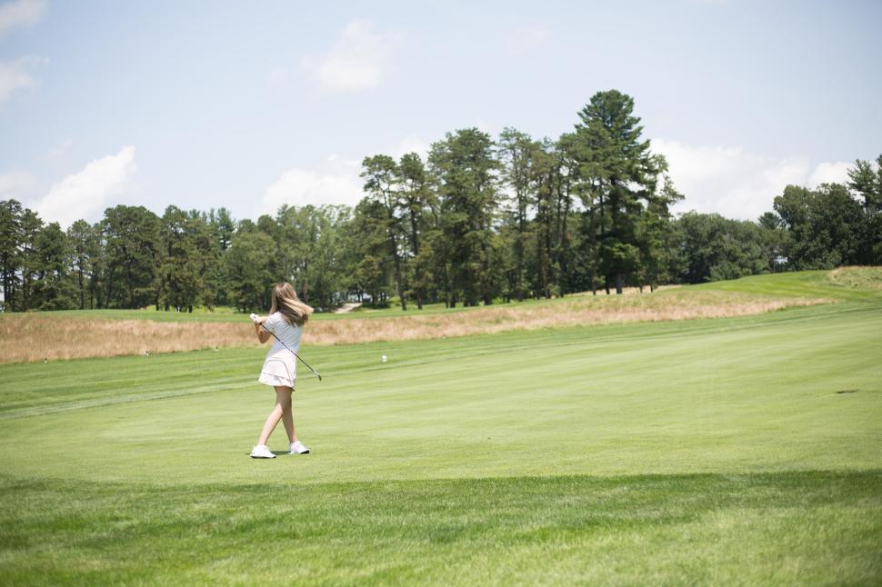 Free Stock Photo of Young girl playing golf in green field, mid-swing ...
