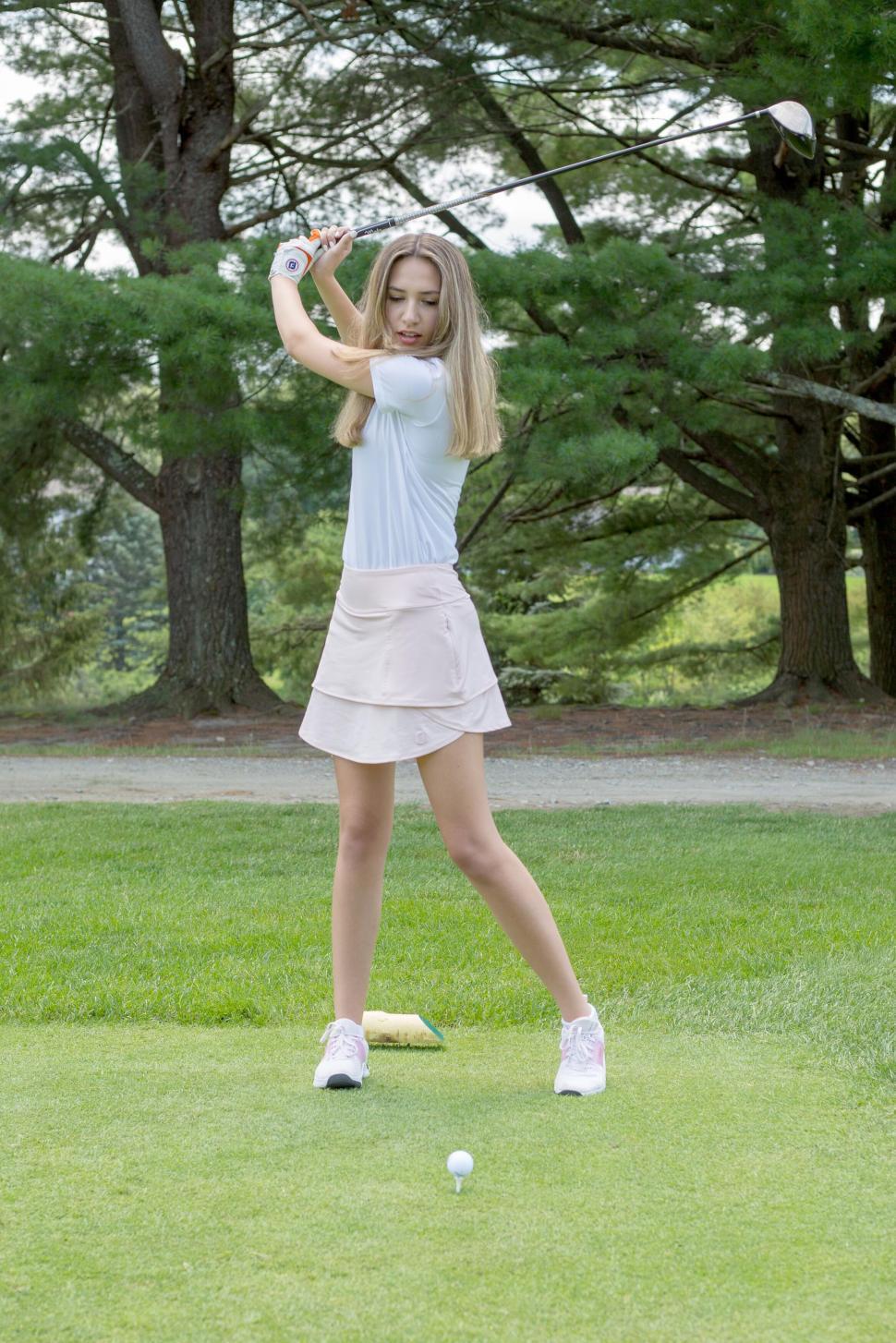 Free Stock Photo of Woman golf player swinging club on green golf ...