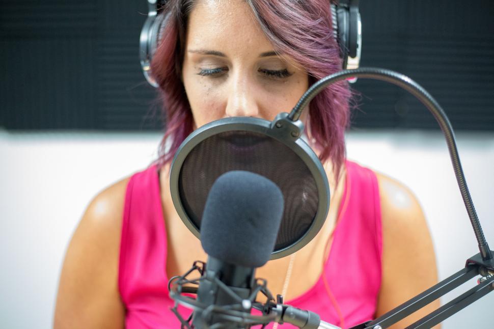 Free Stock Photo of Woman recording vocals in studio with microphone ...