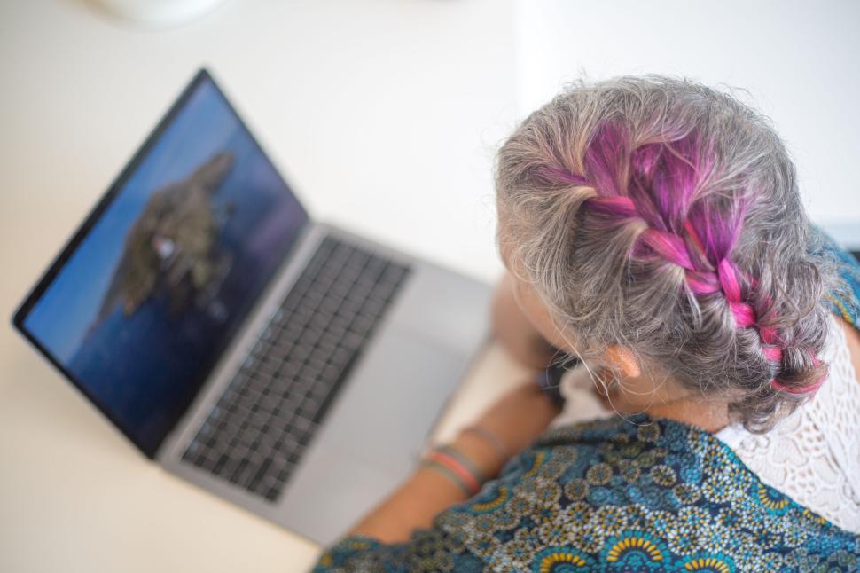 Free Stock Photo of Person with colorful braid watching laptop screen ...