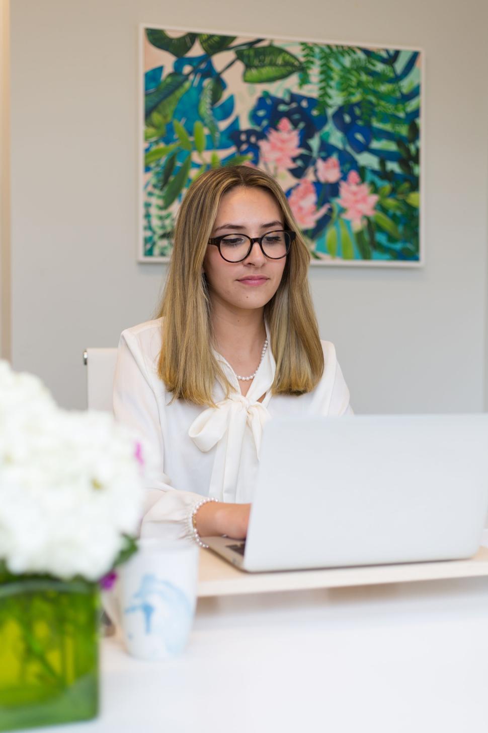 Free Stock Photo of Focused woman on laptop in modern office ...