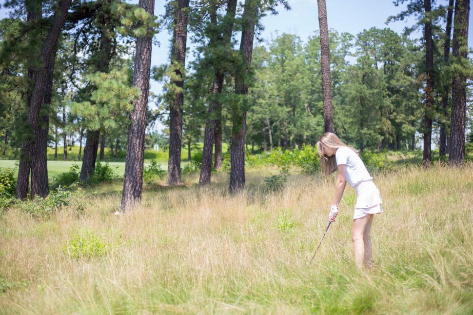 Free Stock Photo of Woman playing golf in an outdoor grassy field with ...