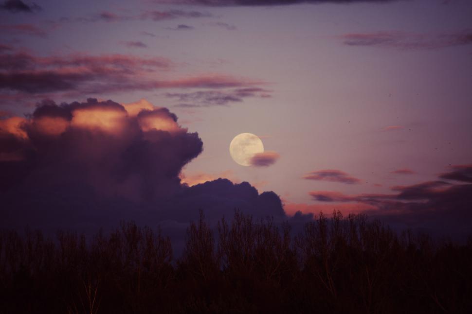 Free Stock Photo of Full moon rising behind dark clouds with a backdrop ...