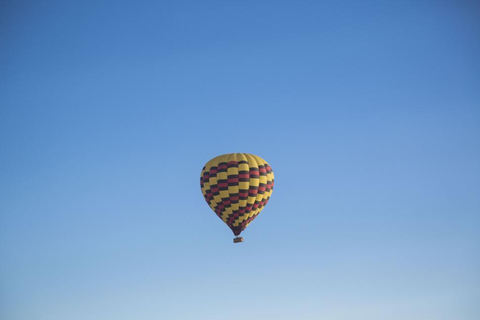 Free Stock Photo of Colorful hot air balloon floating against a clear ...