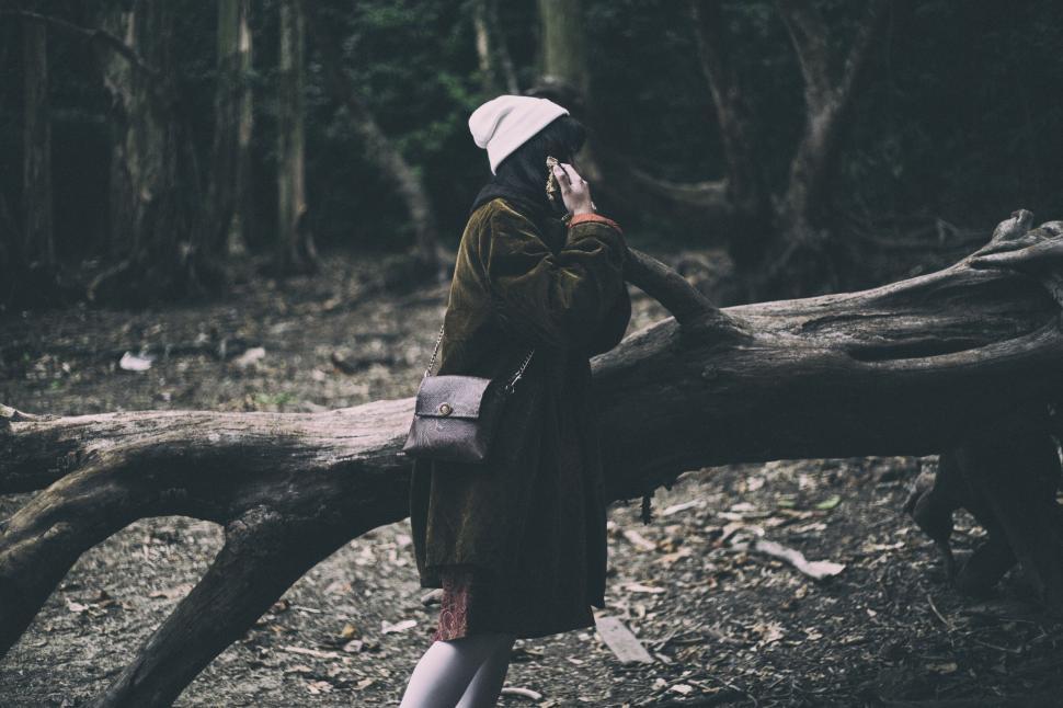Free Stock Photo of Person in Winter Clothes Talking on Phone Beside ...