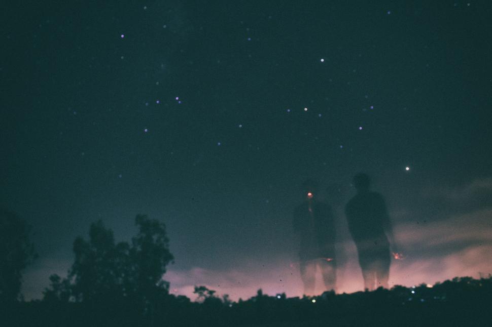 Free Stock Photo of Ghostly figures under a starry night sky in an ...