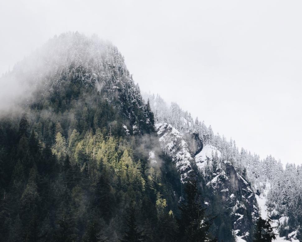 Free Stock Photo of Snow-capped mountain peak partially shrouded in mist and fog. | Download ...