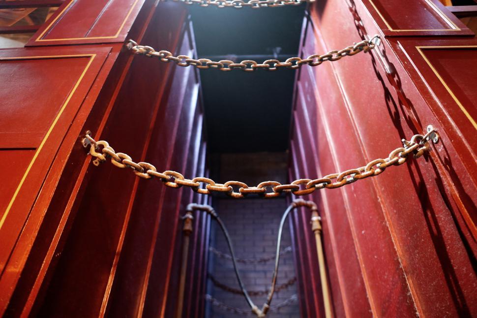 Free Stock Photo of Chains hanging between red panels in symmetrical ...