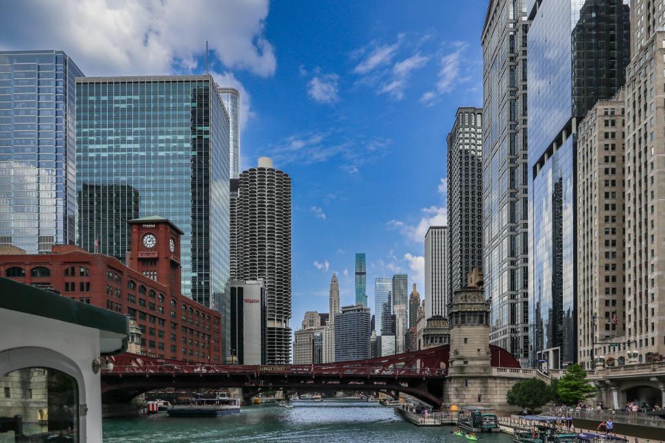 Free Stock Photo of Urban cityscape with river bridge under a bright ...