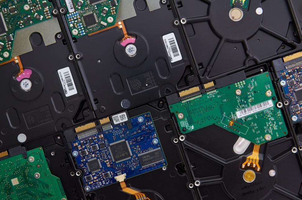 Free Stock Photo of Array of hard drives with various colored circuit ...