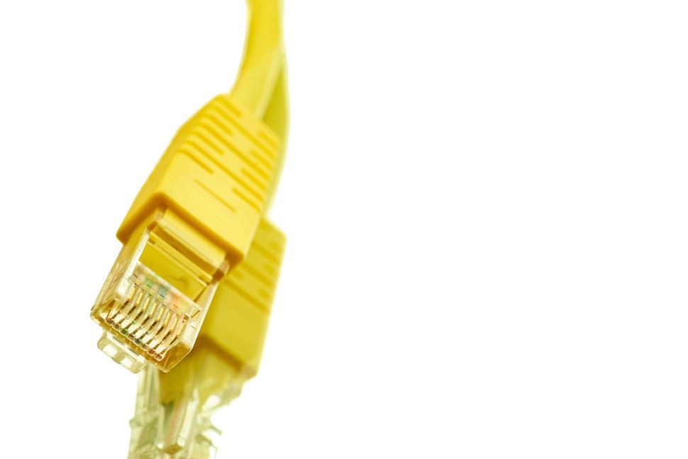 Free Stock Photo of Yellow ethernet cable with clear connectors on a ...